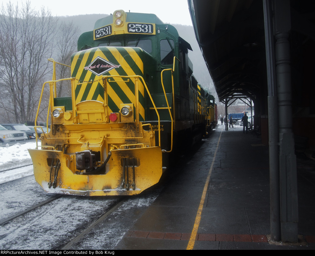 RBMN 2531 backs through the ex-CNJ passenger station in Jim Thorpe to couple onto the Cupid's ...
